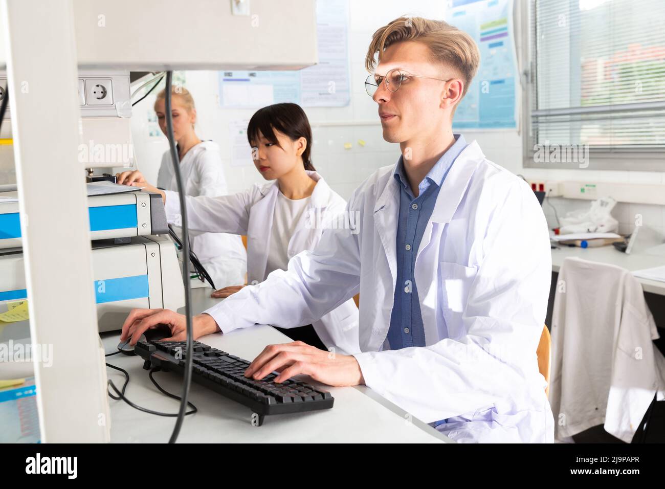 Male scientist engaged in research in laboratory Stock Photo - Alamy