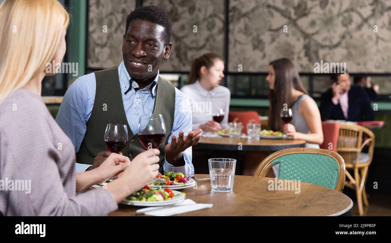 Confident African American businessman with female partner having ...