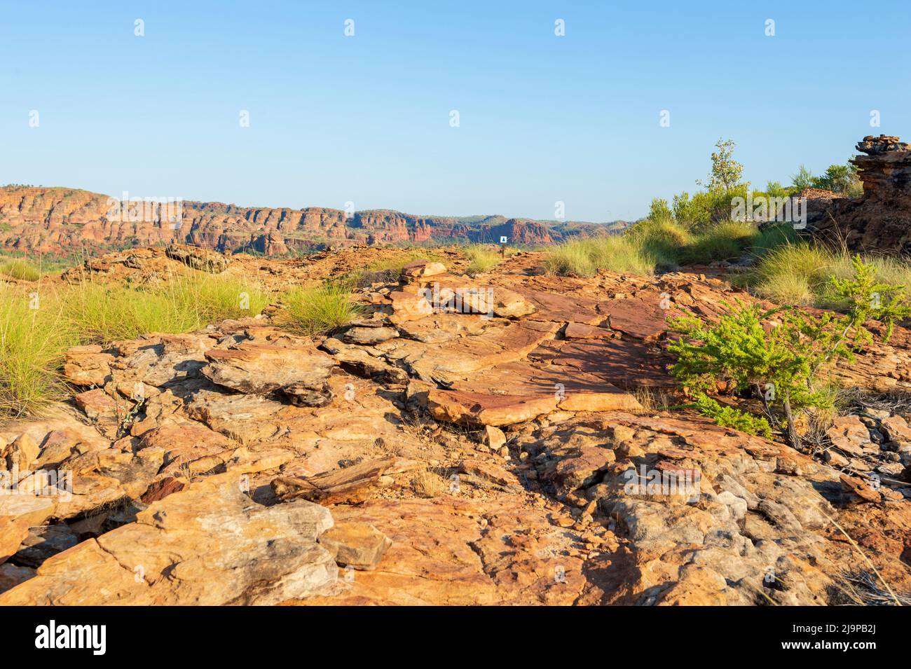 Walking trail through eroded sandstone rock formations in Keep River ...