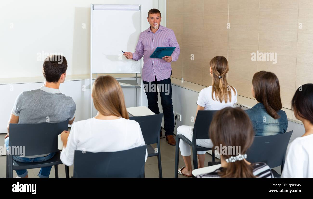 Businessman presenting project to partners Stock Photo - Alamy