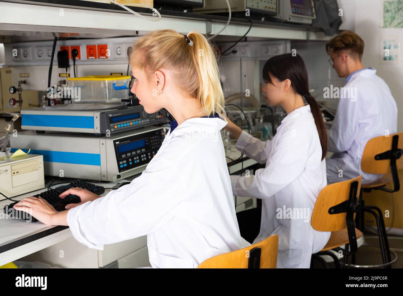 Female student working in laboratory Stock Photo - Alamy