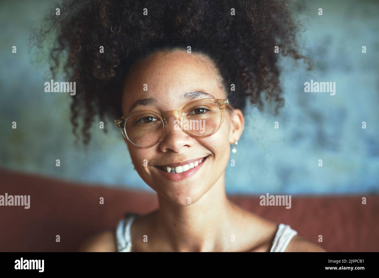 Shot of a beautiful young African woman smiling at the camera Stock ...