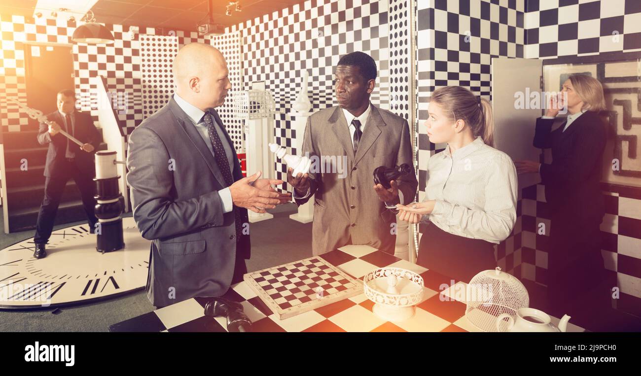 Toned image of businesspeople solving conundrums Stock Photo - Alamy
