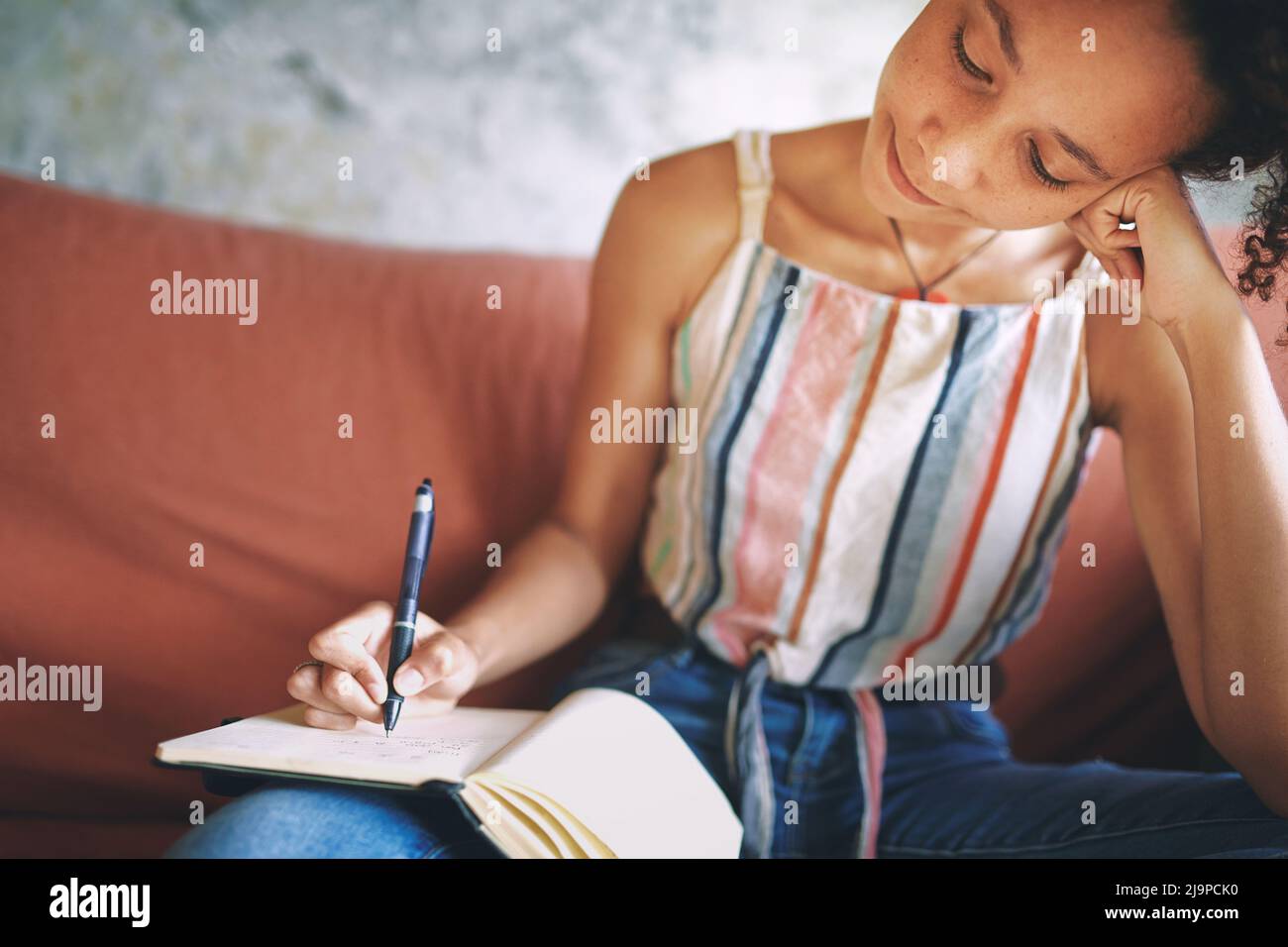 Just writing in my journal - stock photo Stock Photo - Alamy