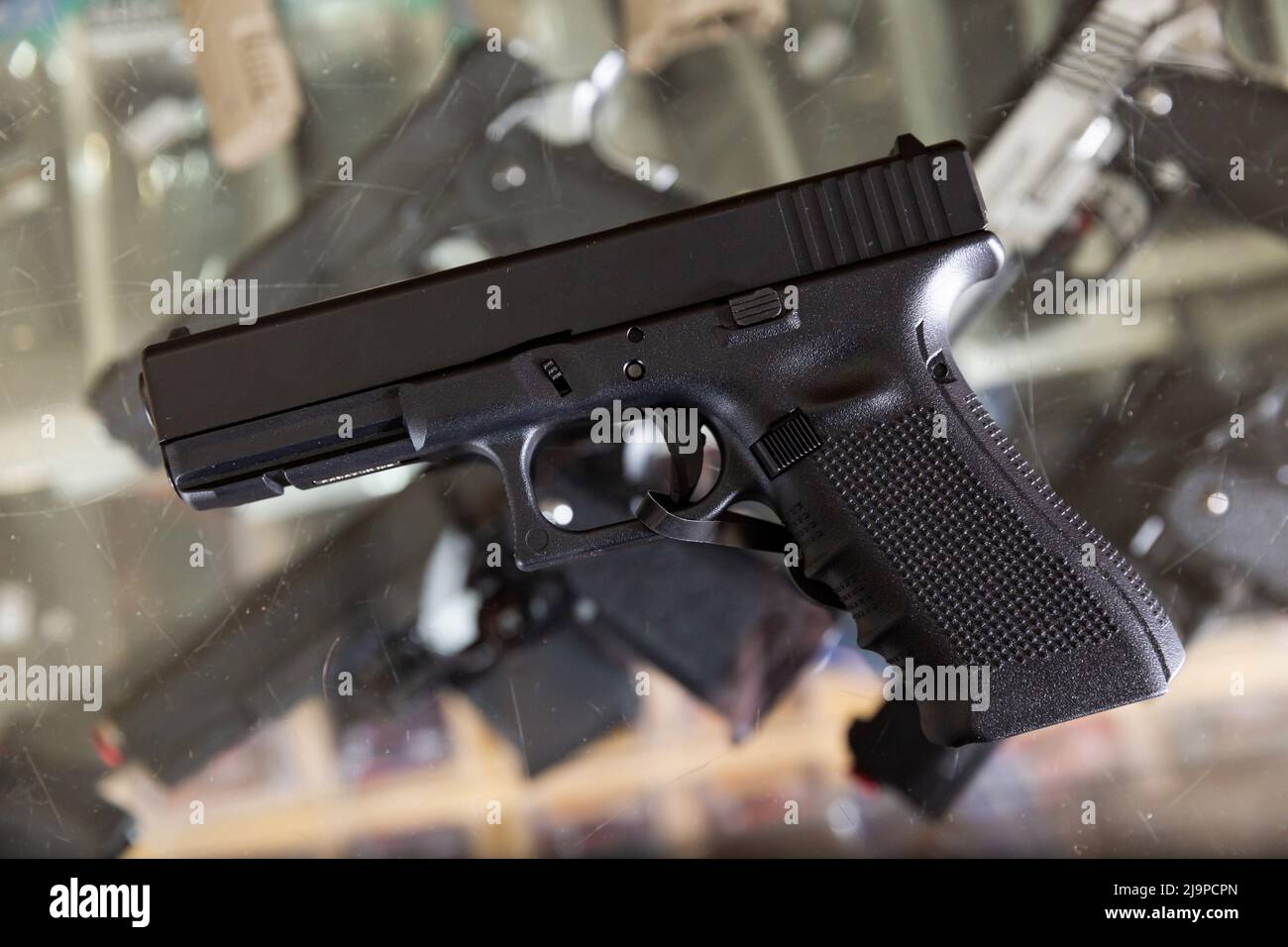 Replica of handgun on showcase Stock Photo - Alamy