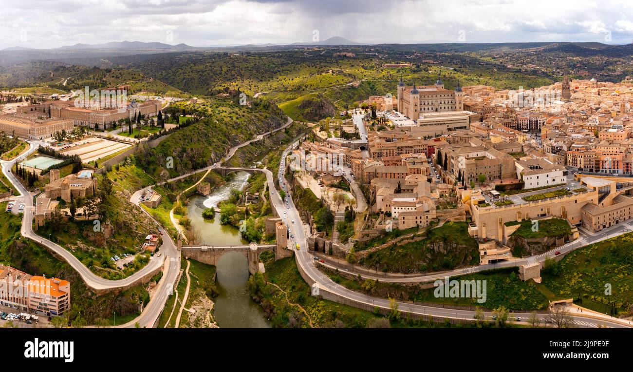 Aerial view of Toledo cityscape on Tagus river with Alcazar castle ...