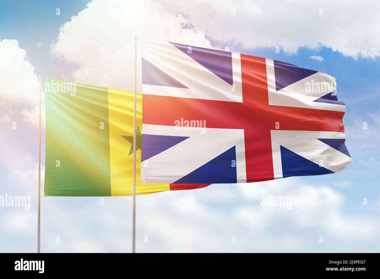 Sunny blue sky and flags of great britain and senegal Stock Photo - Alamy