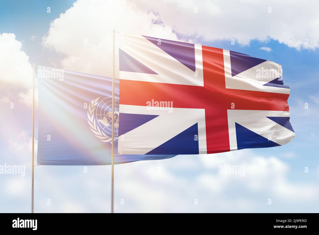 Sunny blue sky and flags of great britain and united nations Stock ...