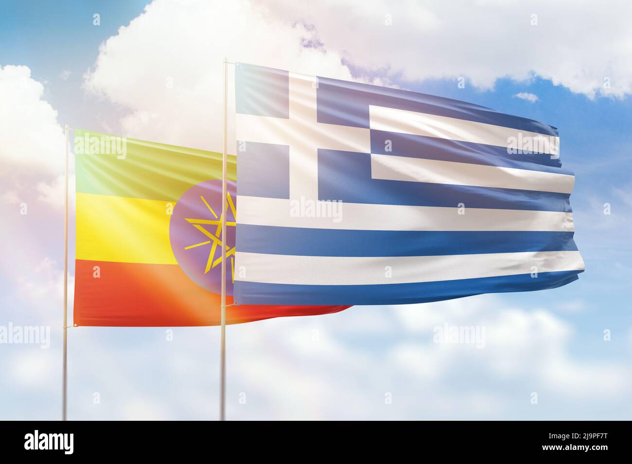 Sunny blue sky and flags of greece and ethiopia Stock Photo - Alamy
