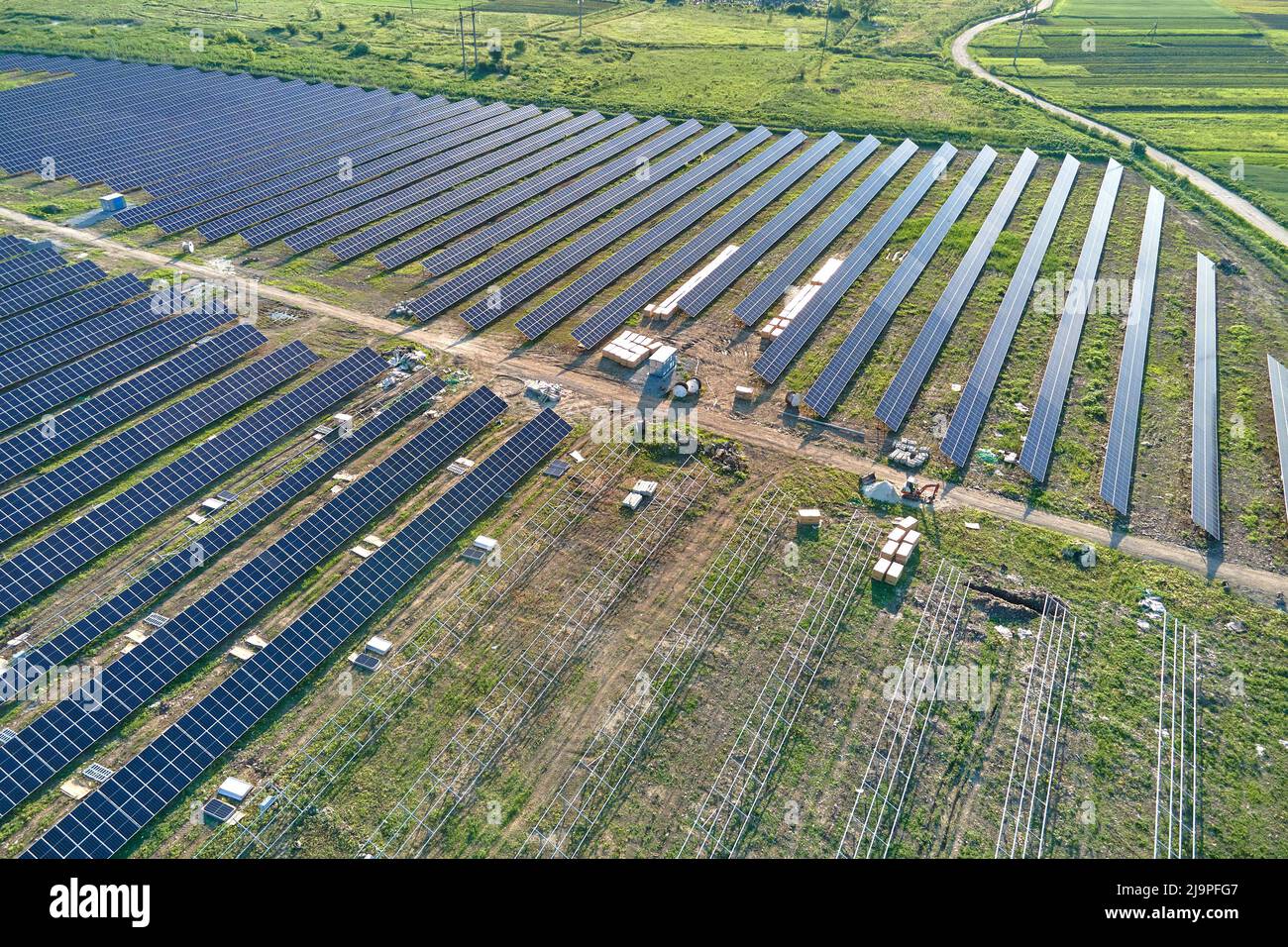 Aerial view of big electric power plant under construction with many ...