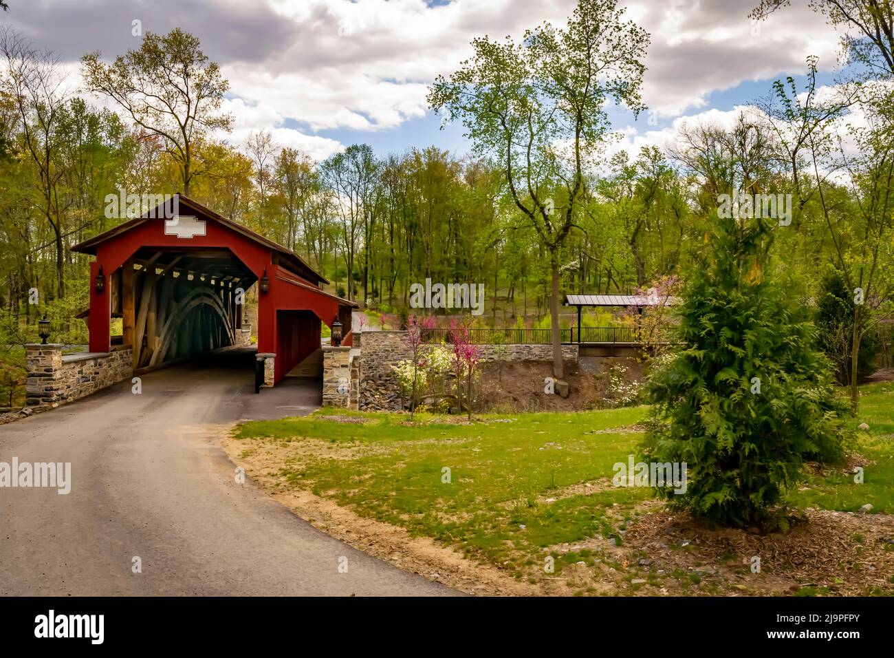 View of a Restored Burr Truss Covered Bridge on a Country Road With ...