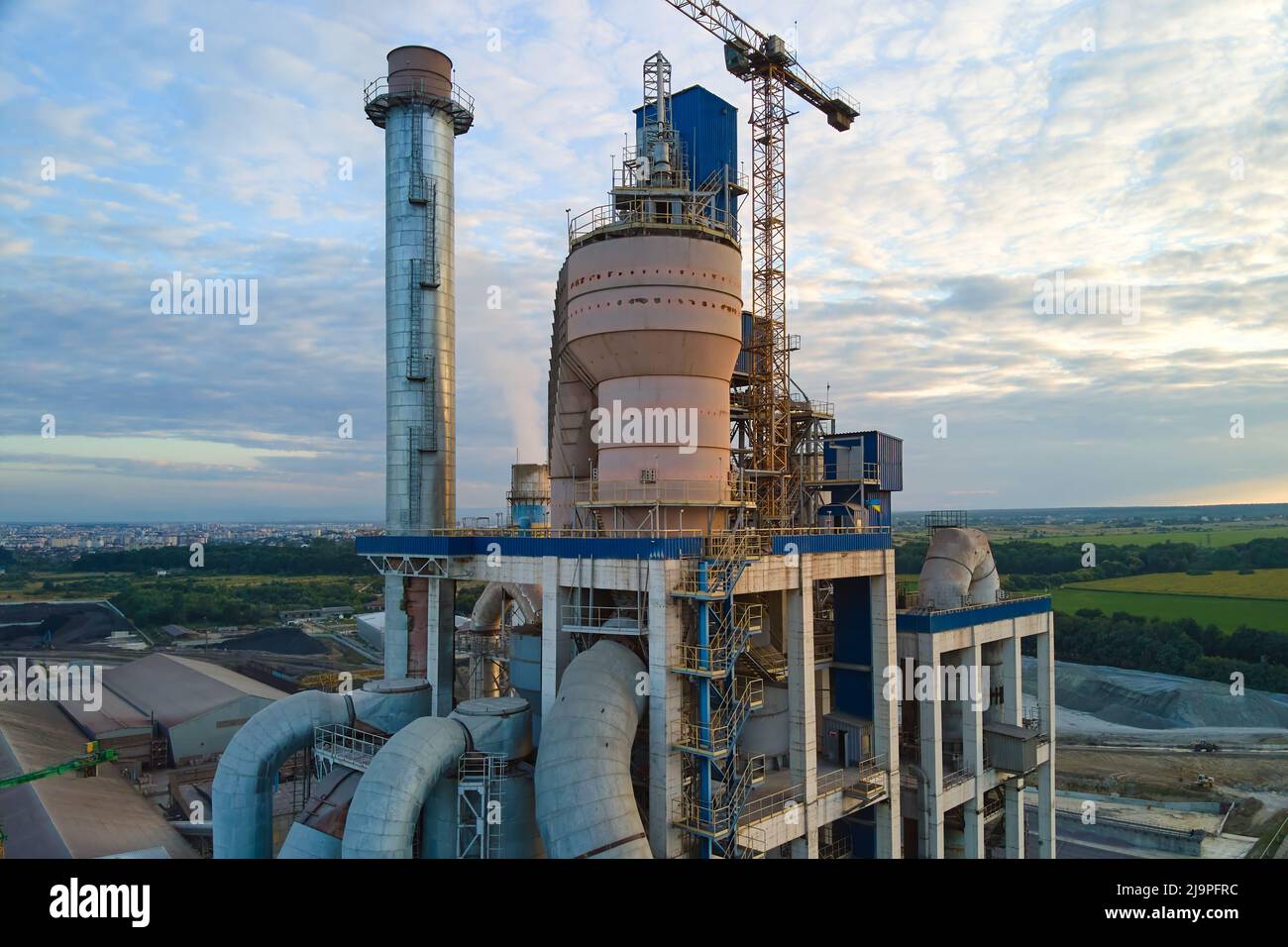 Aerial view of cement factory with high concrete plant structure and ...