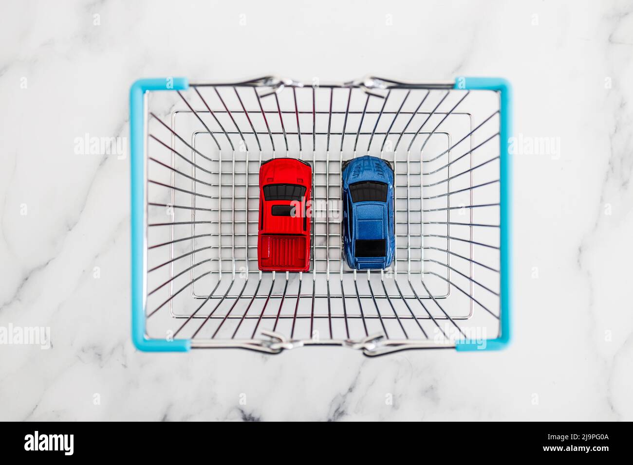 choosing a new car to buy, toy cars in different colours and shape ...