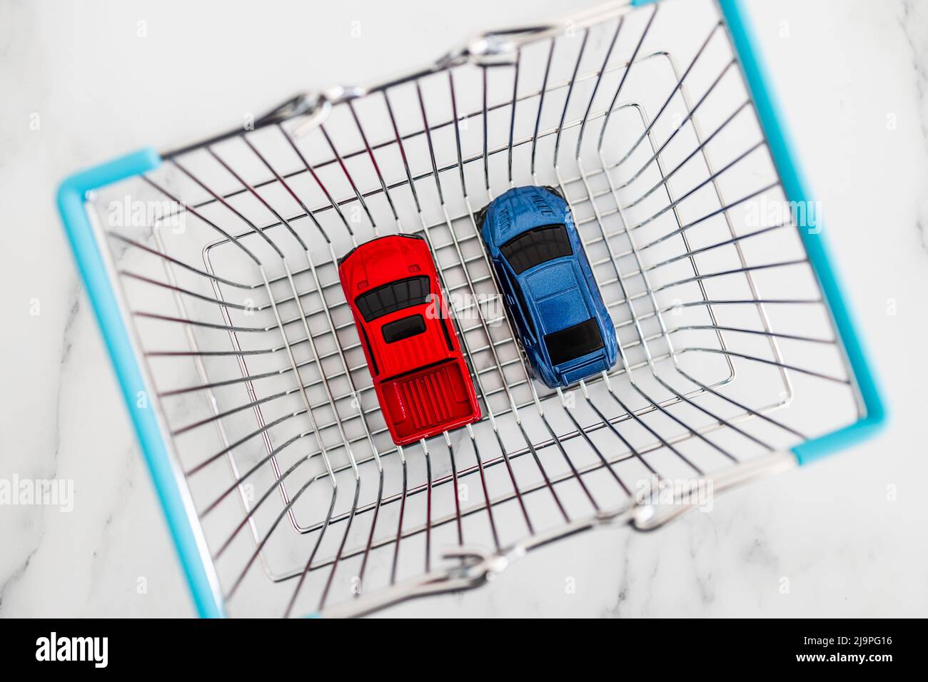 choosing a new car to buy, toy cars in different colours and shape ...
