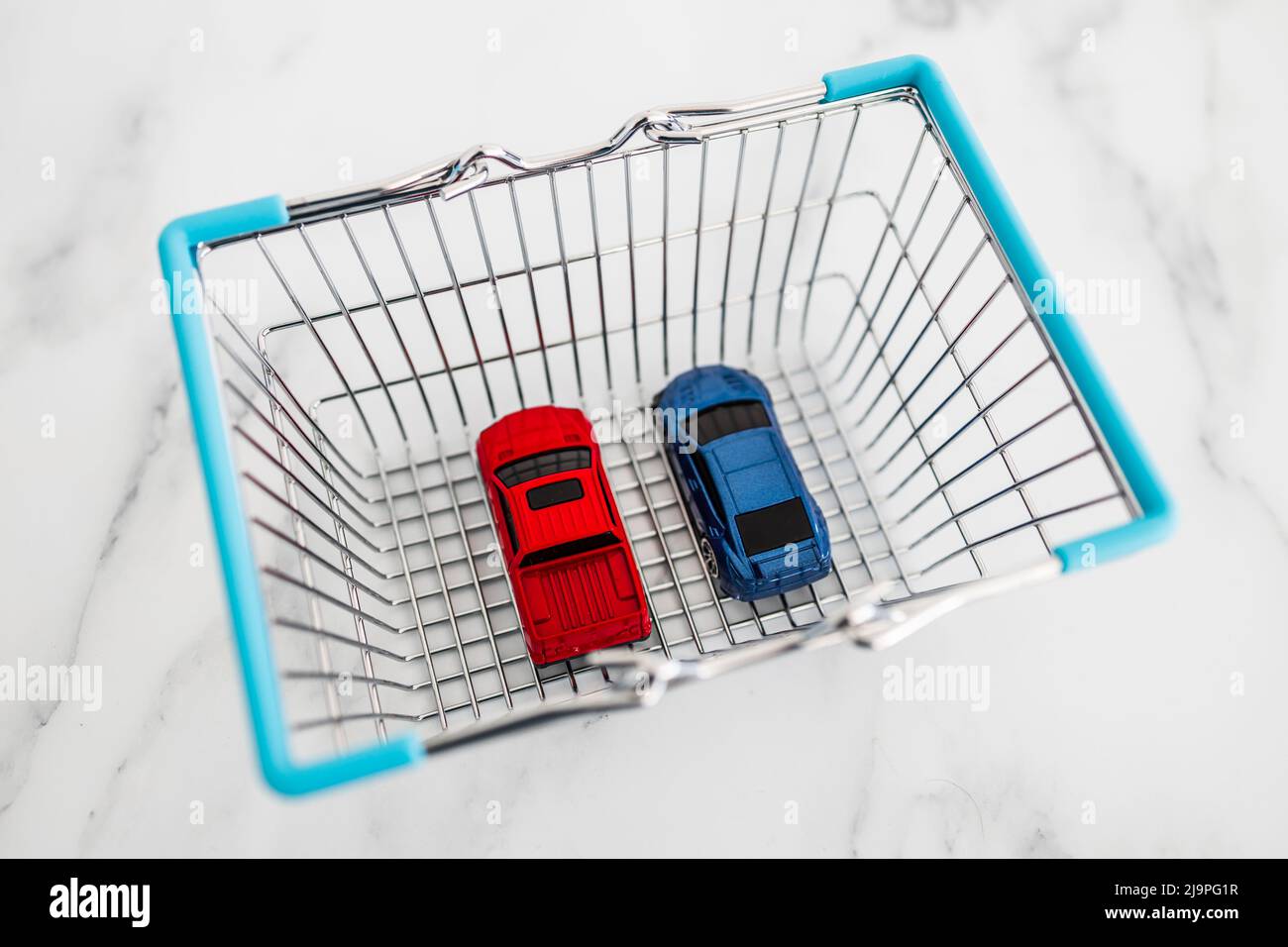 choosing a new car to buy, toy cars in different colours and shape ...