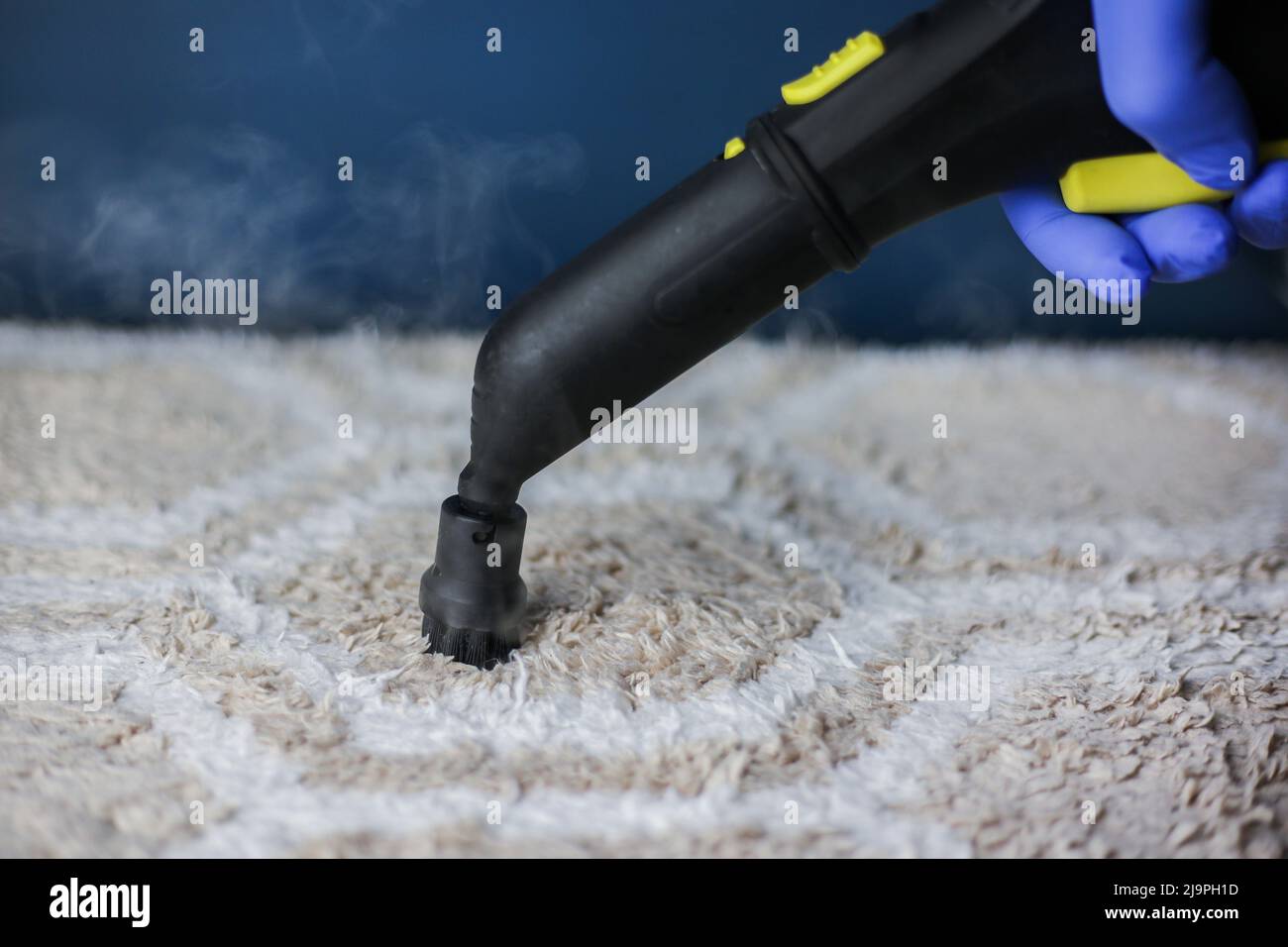 Cleaning and disinfection of a light-colored carpet with hot steam on ...