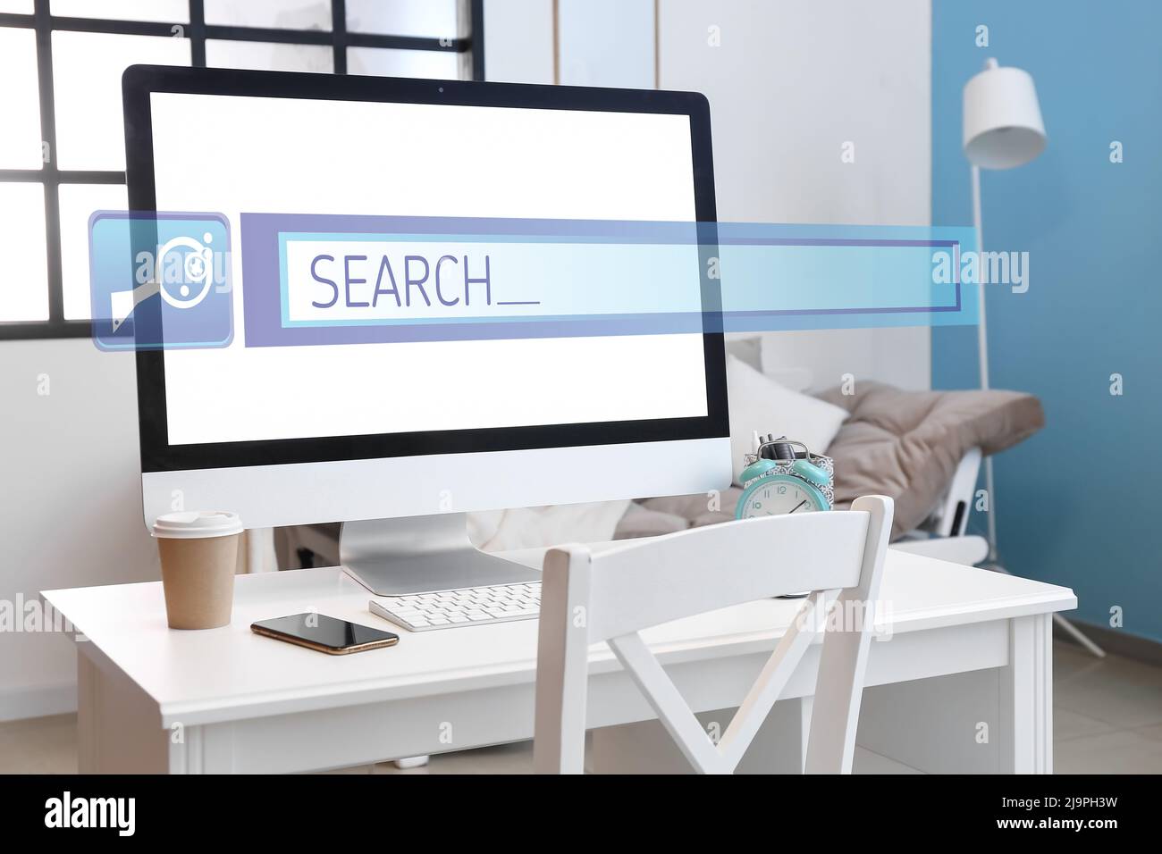 Modern computer on table in room. Concept of search Stock Photo - Alamy
