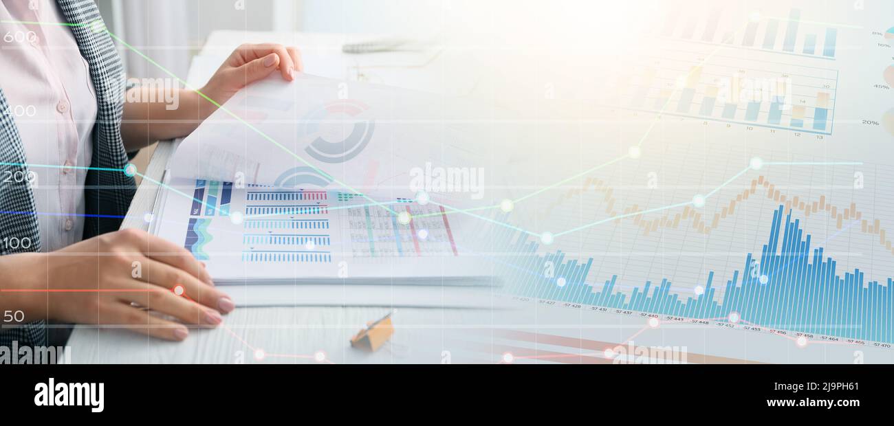 Female economist working in modern office Stock Photo - Alamy