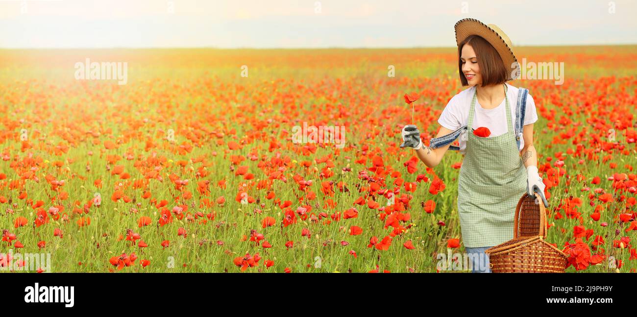 Beautiful female farmer in poppy field Stock Photo - Alamy