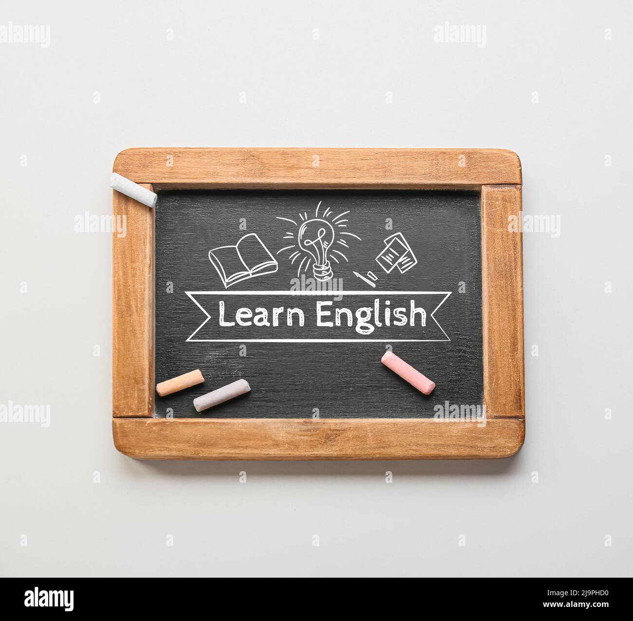 Chalkboard with text LEARN ENGLISH on white background Stock Photo - Alamy