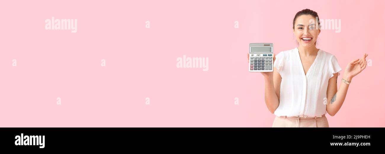 Pretty young businesswoman with calculator on pink background with ...