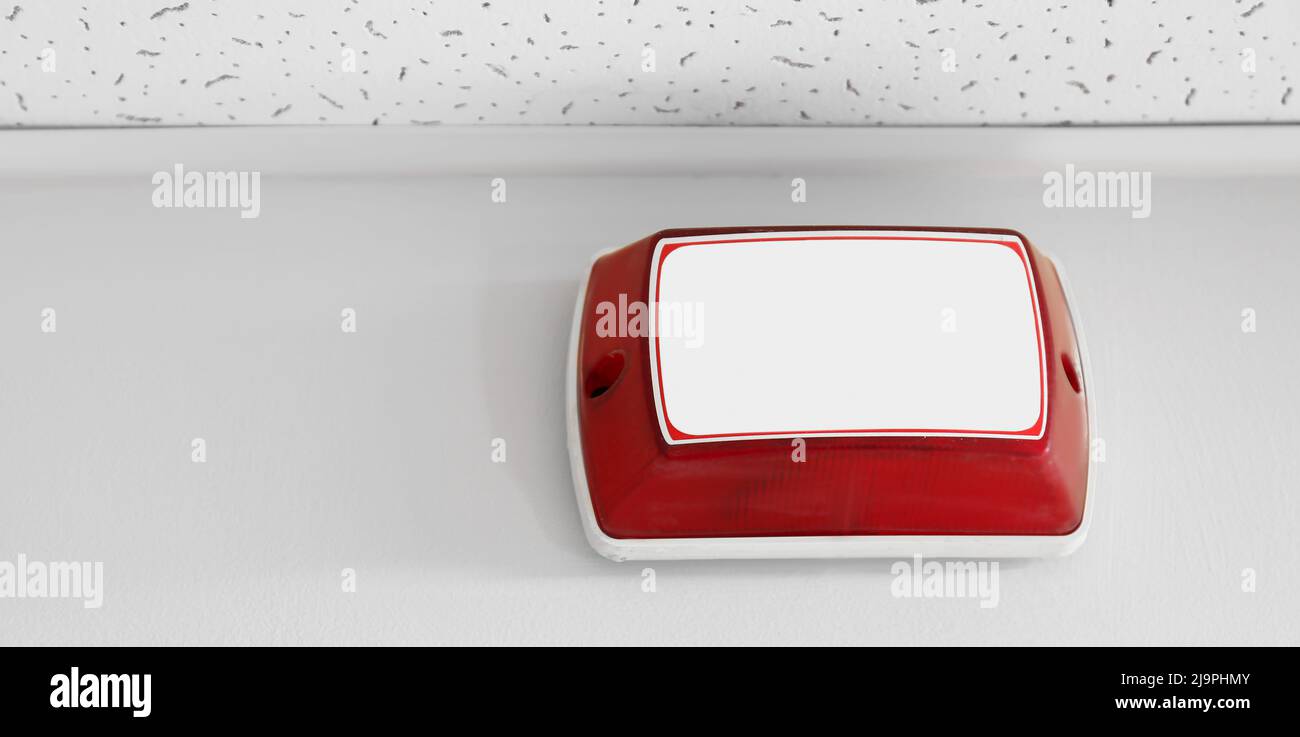 Modern smart home fire alarm installed on wall in room Stock Photo - Alamy