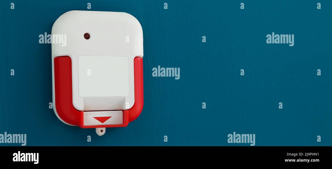 Modern smart home fire alarm installed on wall in room Stock Photo - Alamy