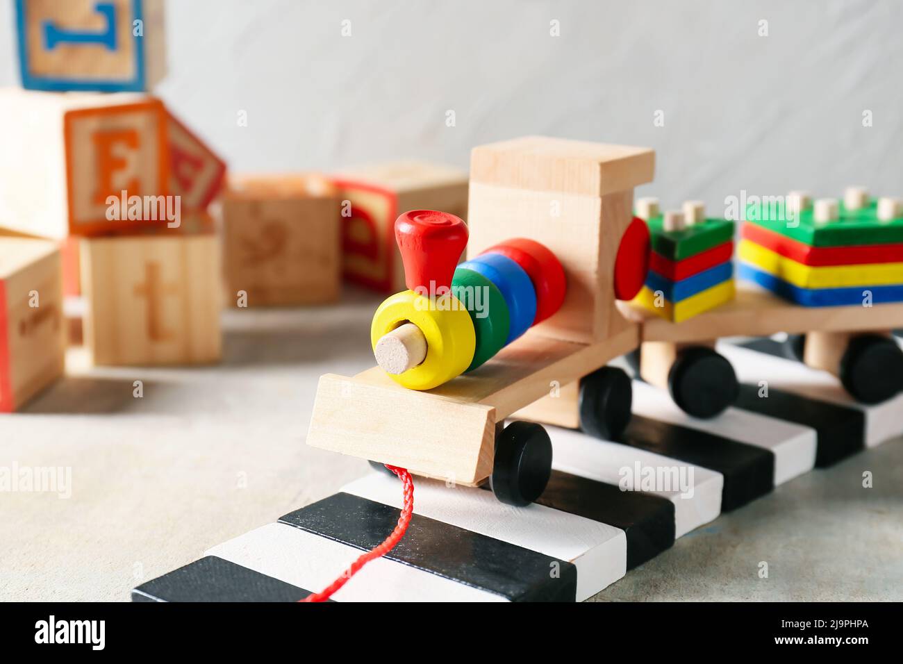 Toy train with building blocks on light background, closeup Stock Photo ...