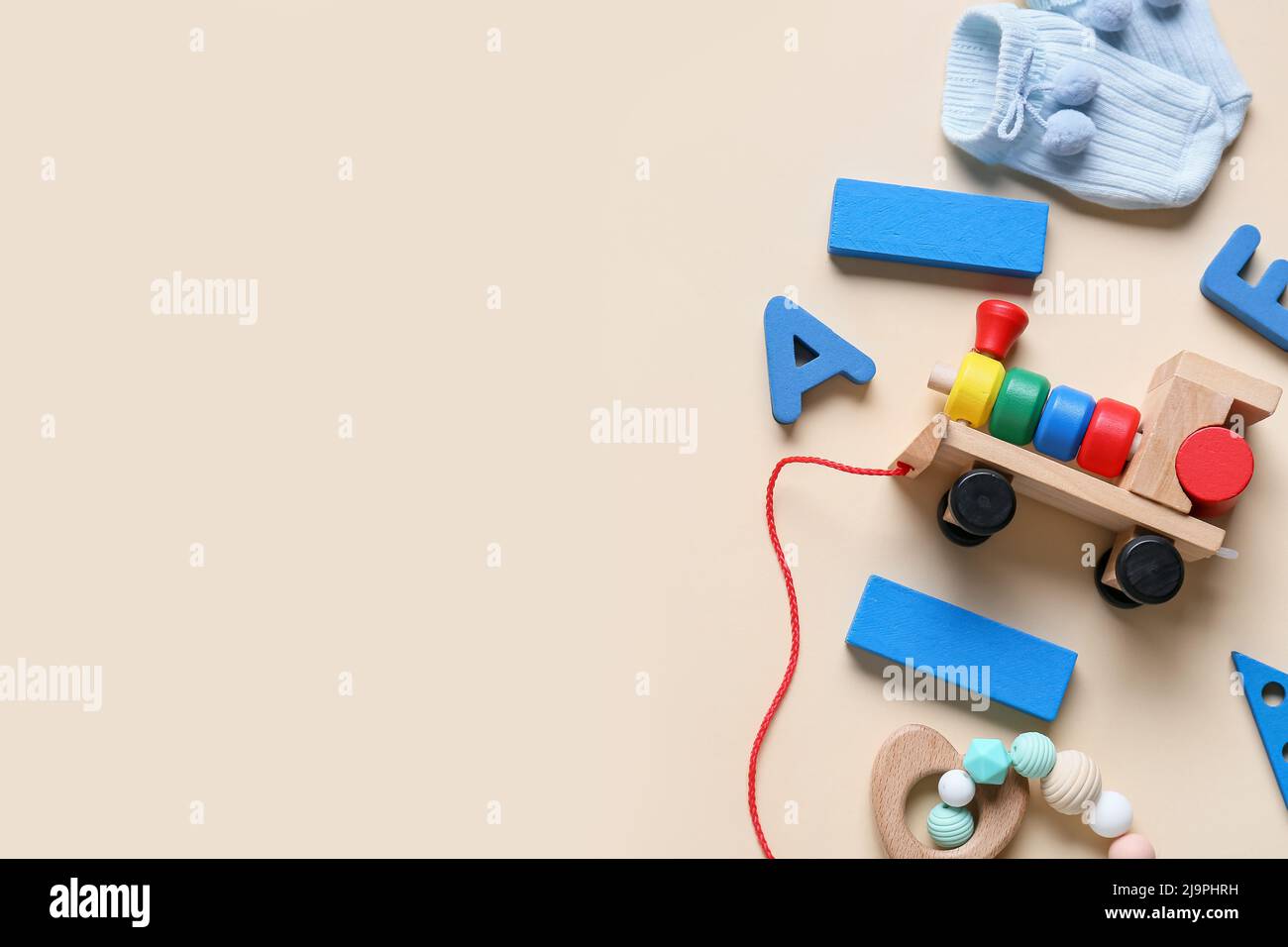 Toy train with building blocks and socks on beige background Stock ...