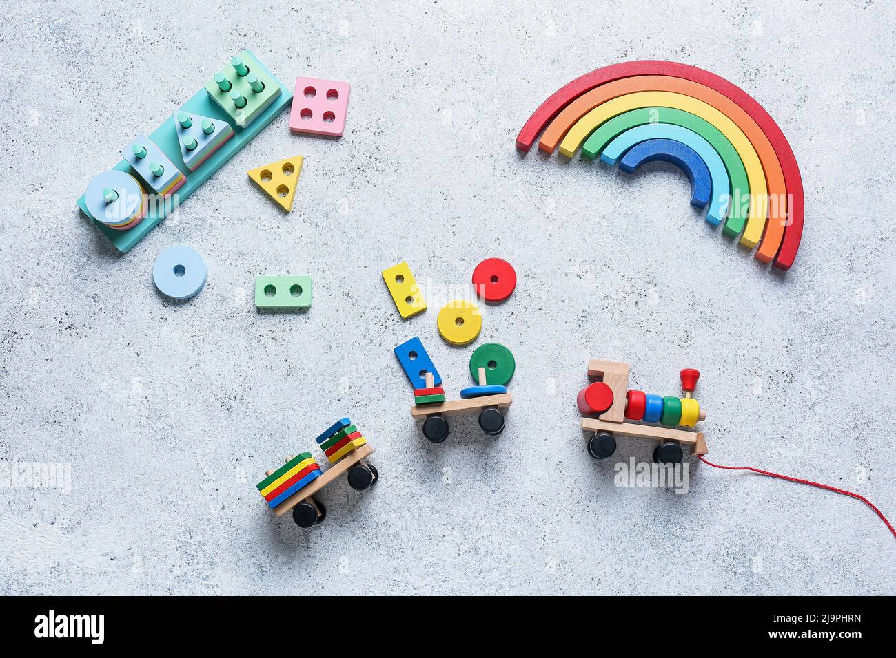 Toy train with building blocks on light background Stock Photo - Alamy