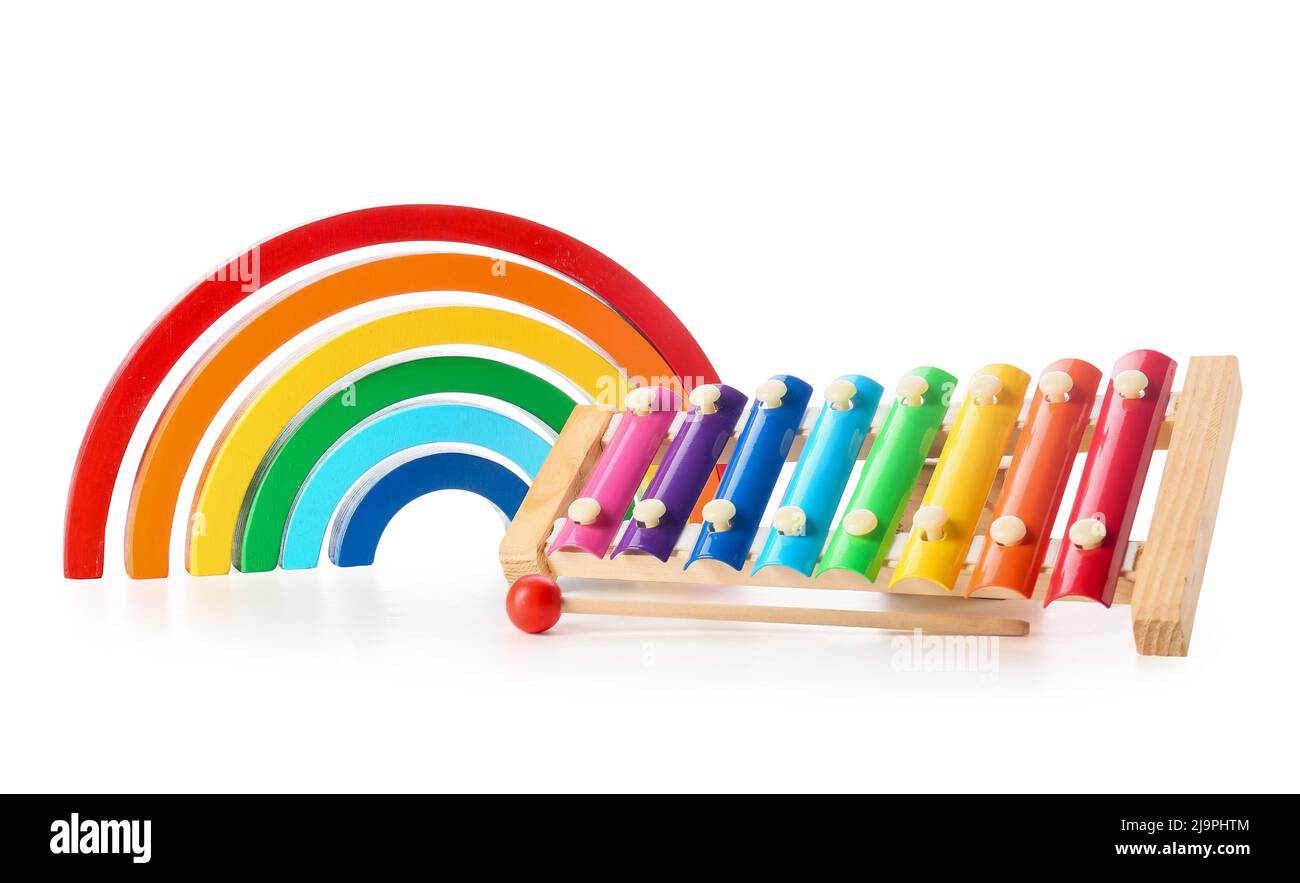 Rainbow made of blocks and xylophone toy on white background Stock ...