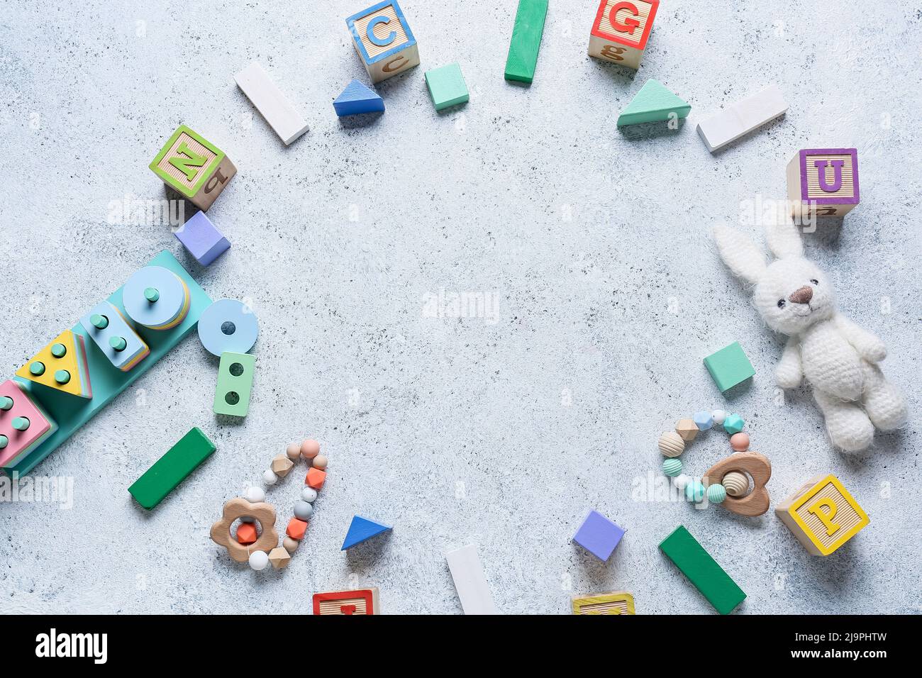 Frame made of children toys on light background Stock Photo - Alamy