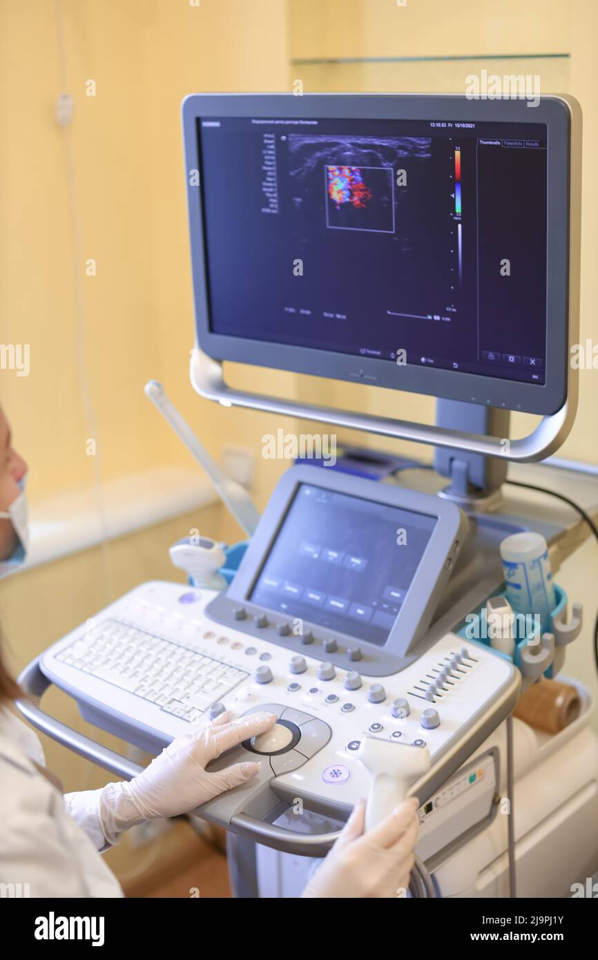 Doctor using ultrasound machine in clinic Stock Photo - Alamy
