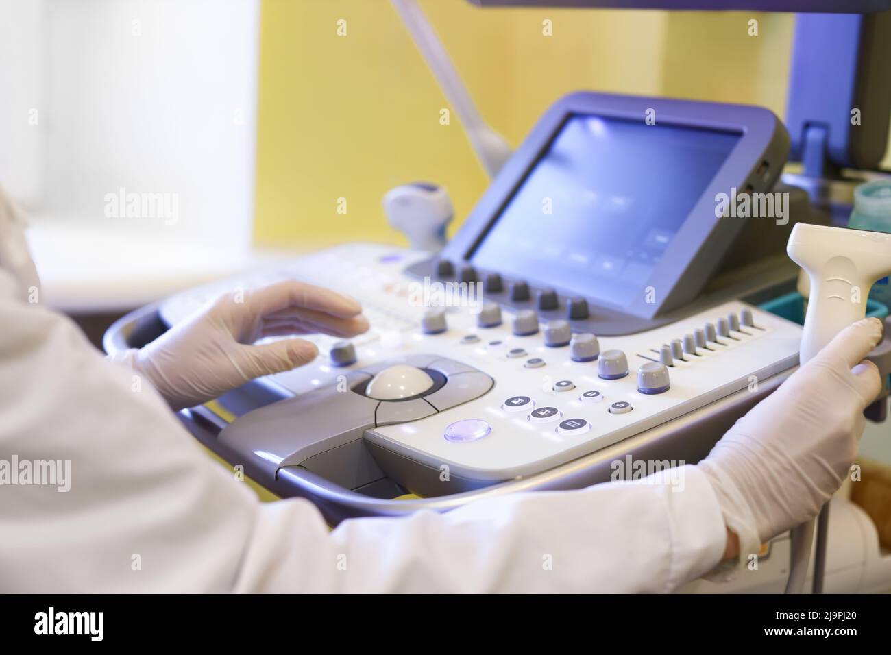 Doctor using ultrasound machine in clinic Stock Photo - Alamy
