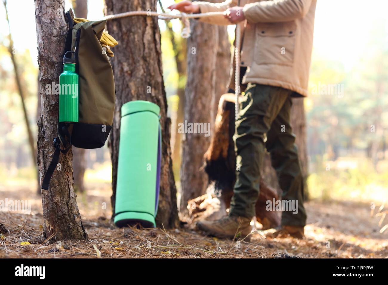 Tying rope tree camping hi-res stock photography and images - Alamy