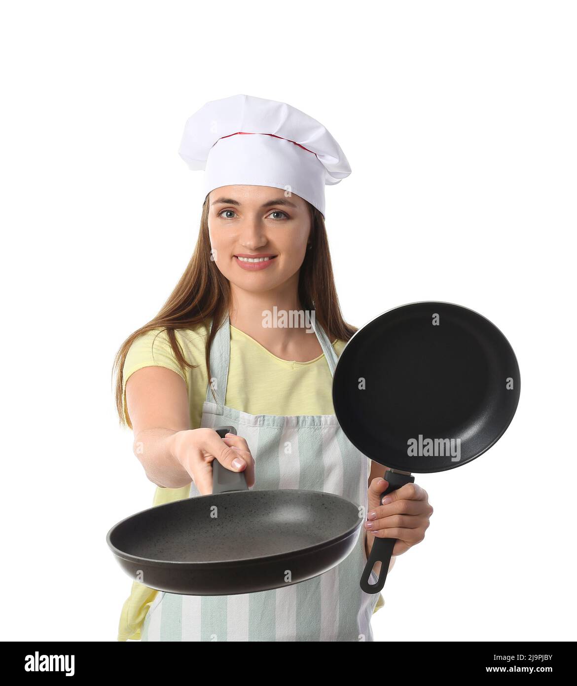 Female chef with frying pans on white background Stock Photo - Alamy