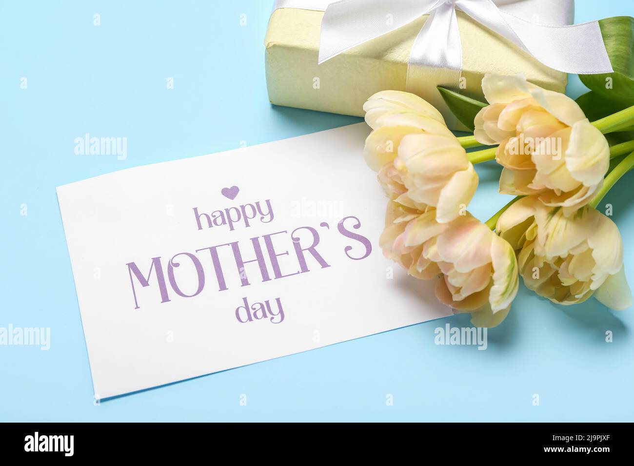 Card with text HAPPY MOTHER'S DAY, flowers and gift box on blue ...