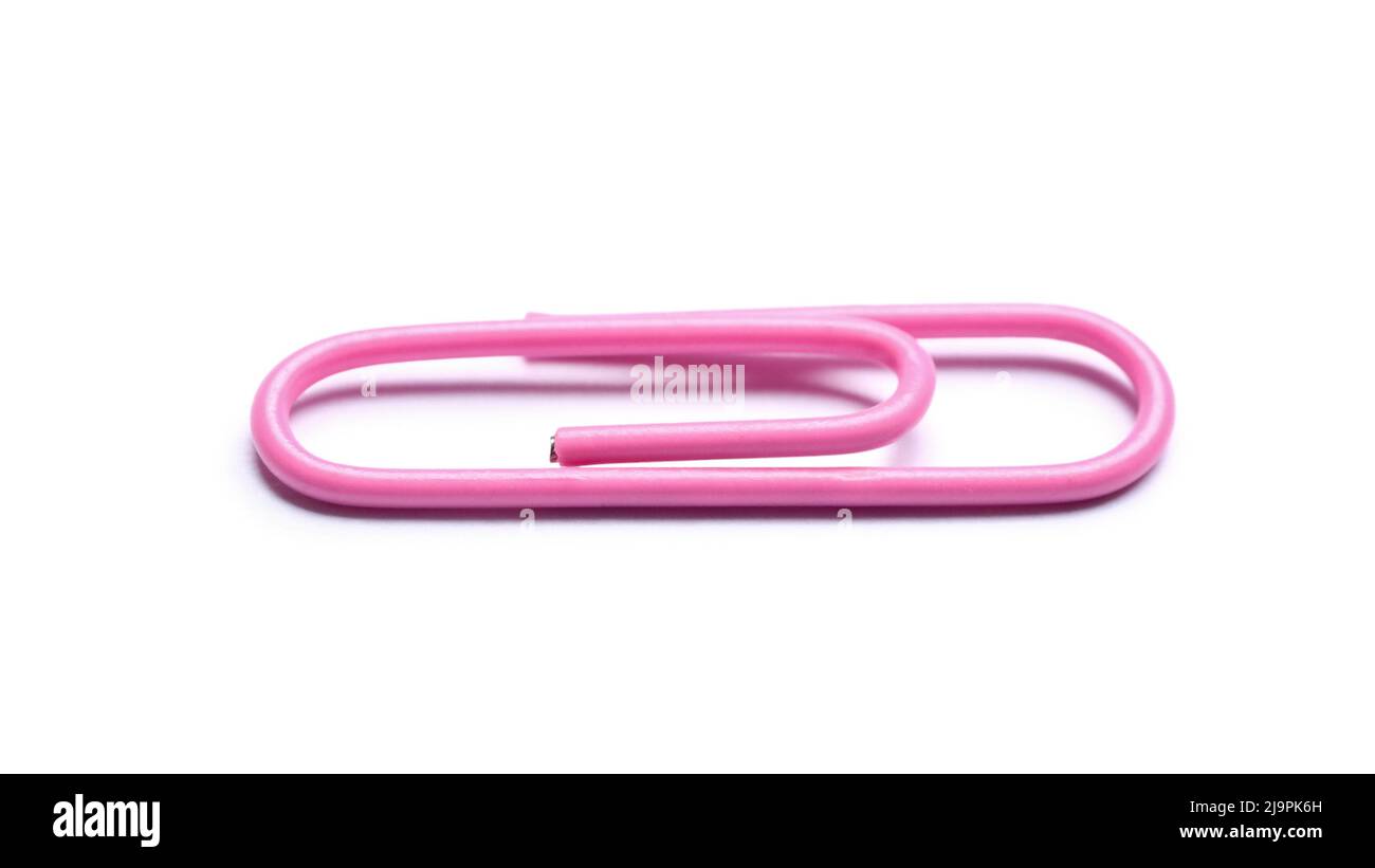 Pink paper clip on white background Stock Photo - Alamy