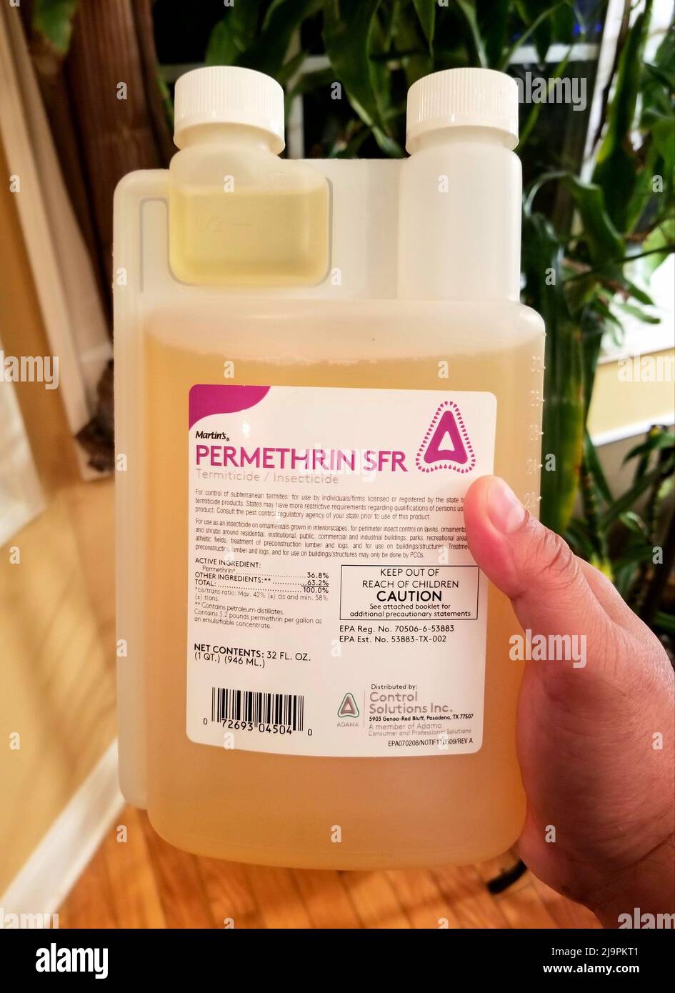 Wilmington, Delaware, U.S.A - May 14, 2022 - Holding a bottle of ...