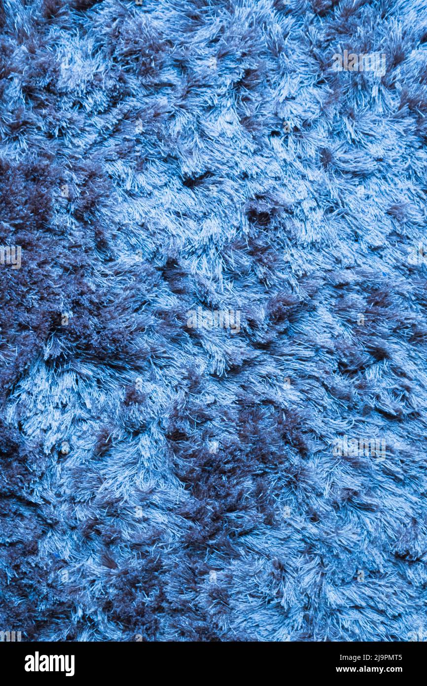 Blue fabric carpet with long pile texture background Stock Photo - Alamy