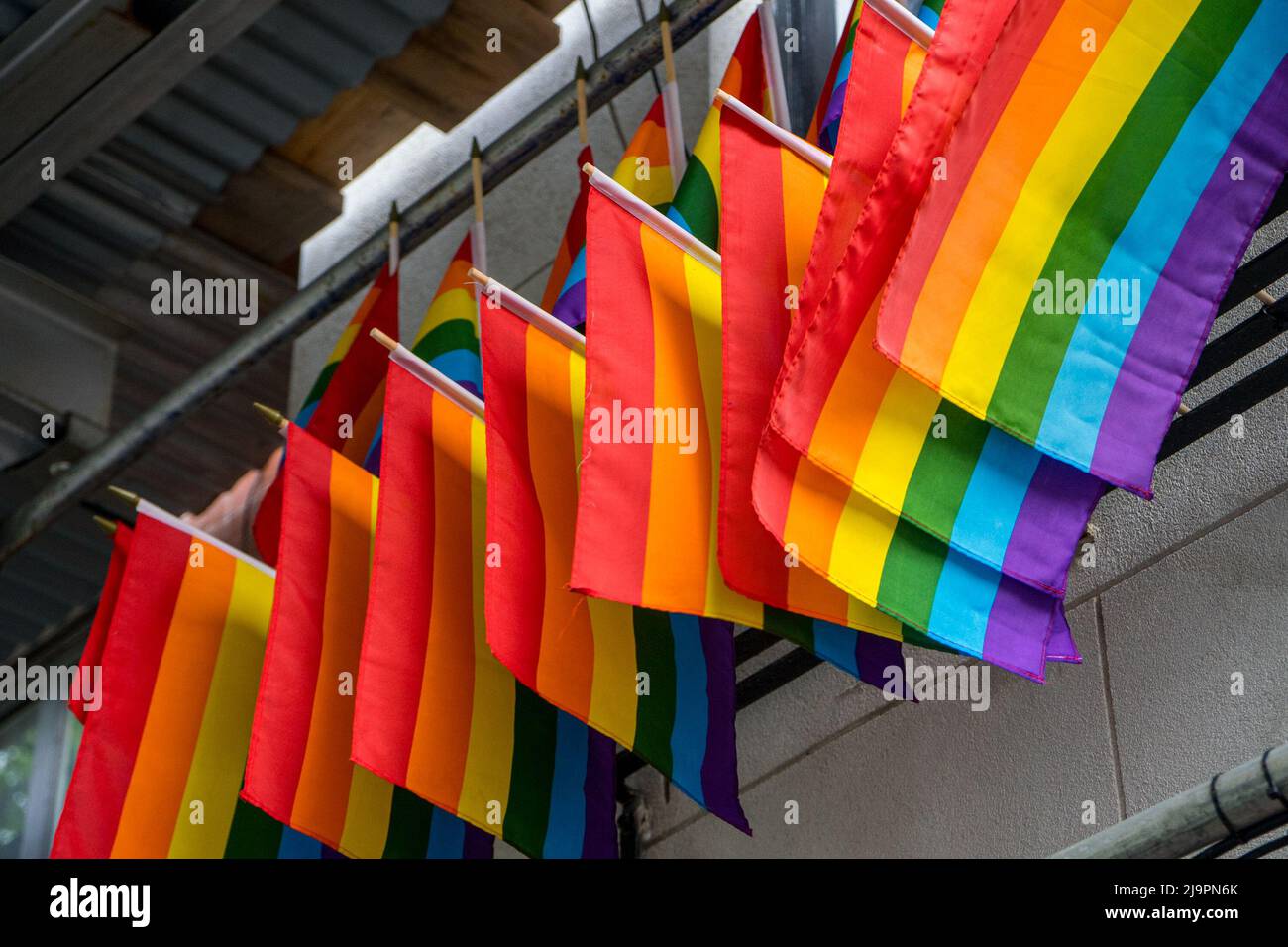 New York, NY - USA - May 20 2022 Closeup of a line of Rainbow flags ...