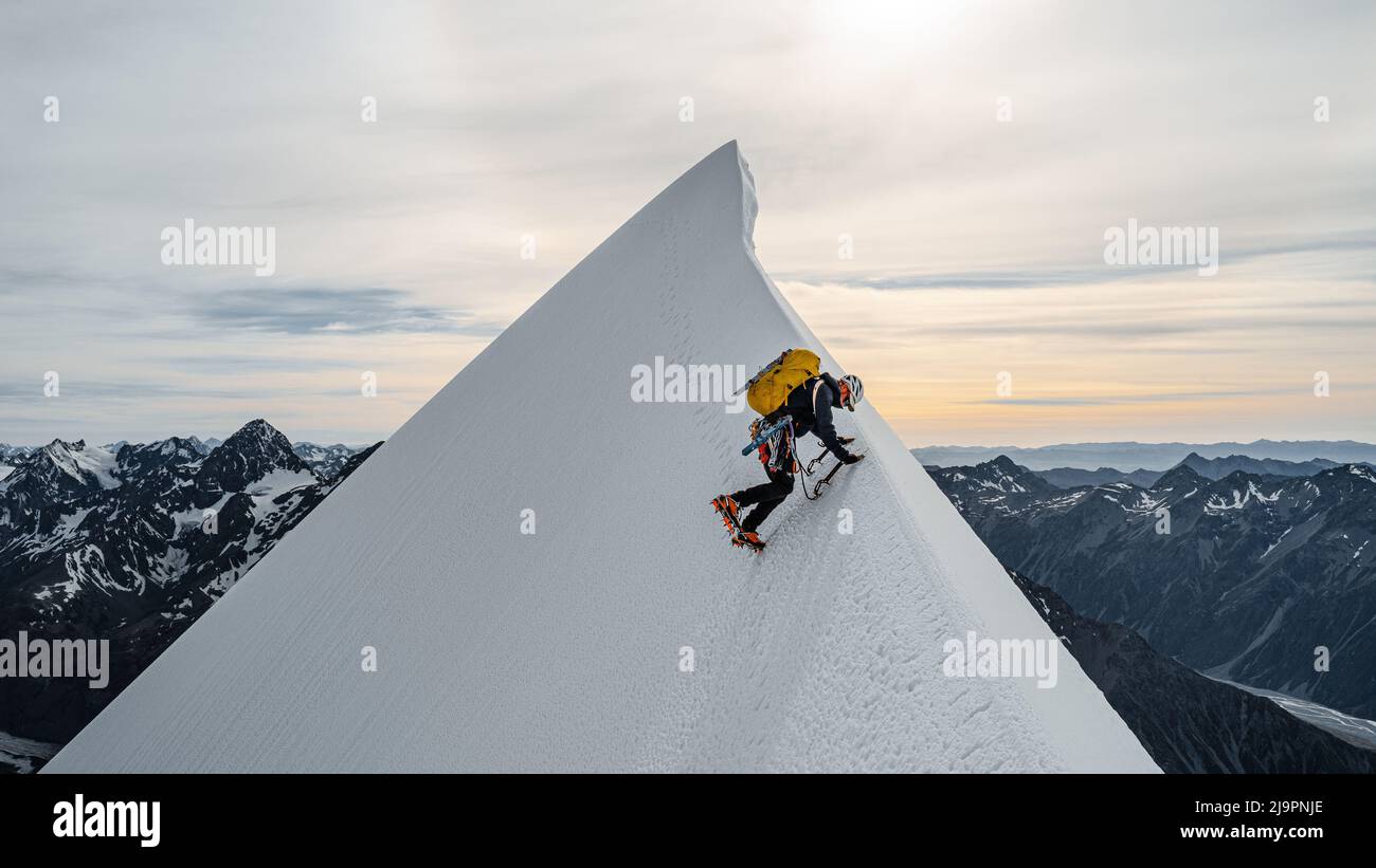 High on the East ridge of Mt Cook. Climbing on a sharp ridge Stock ...