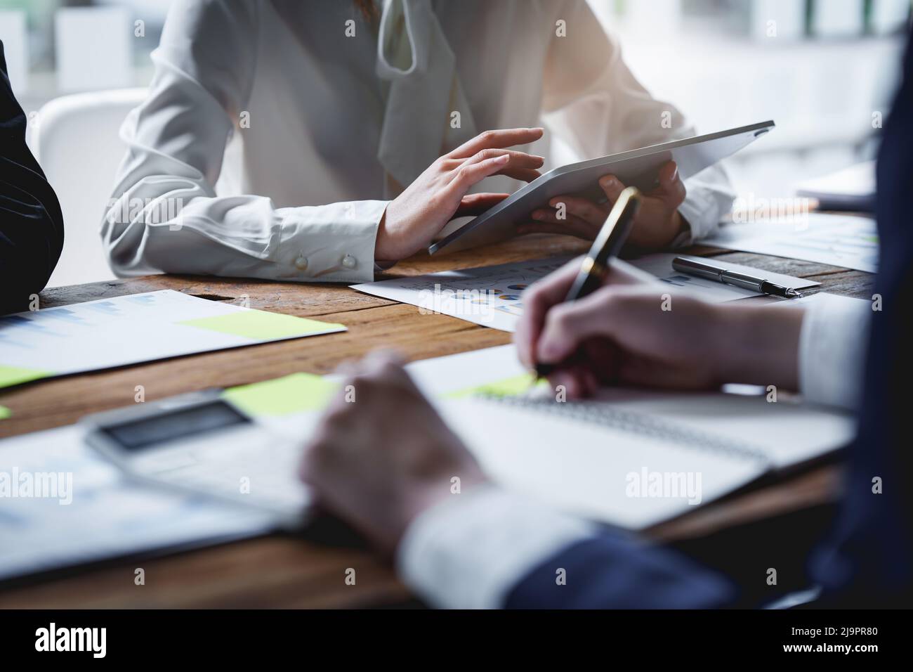 Business team hands at working with financial plan, meeting, discussion ...