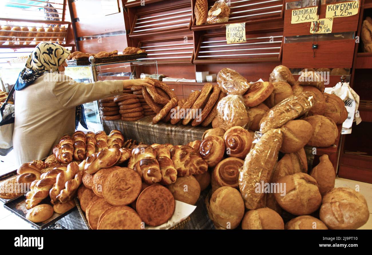 ISTANBUL, TURKEY - JUNE 14: Old Turkish woman shopping at bakery shop ...