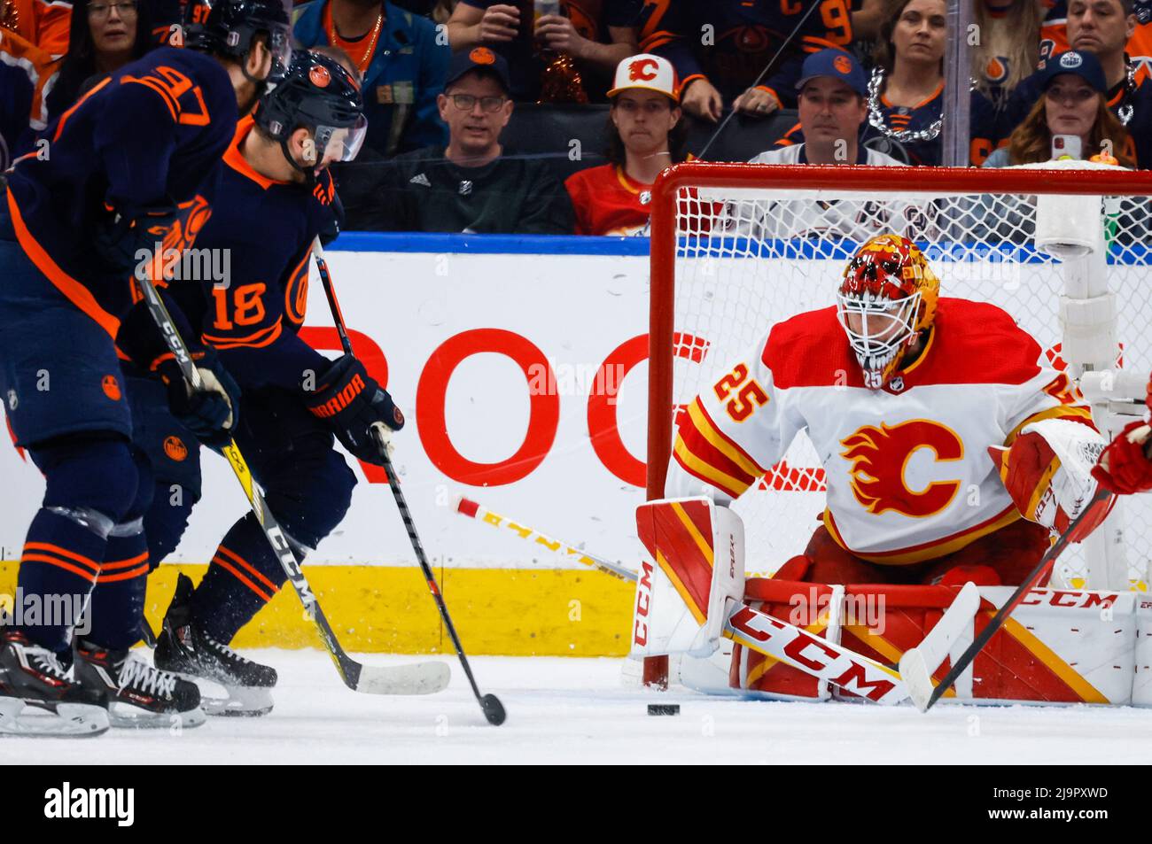 Calgary Flames goalie Jacob Markstrom, right, blocks the net on ...