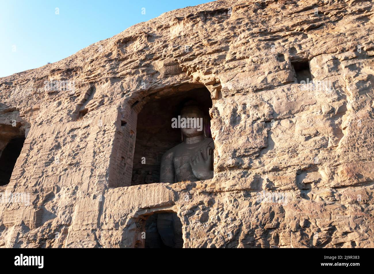 Buddha statue carved at Yungang Grottoes in Datong, Shanxi, China Stock ...