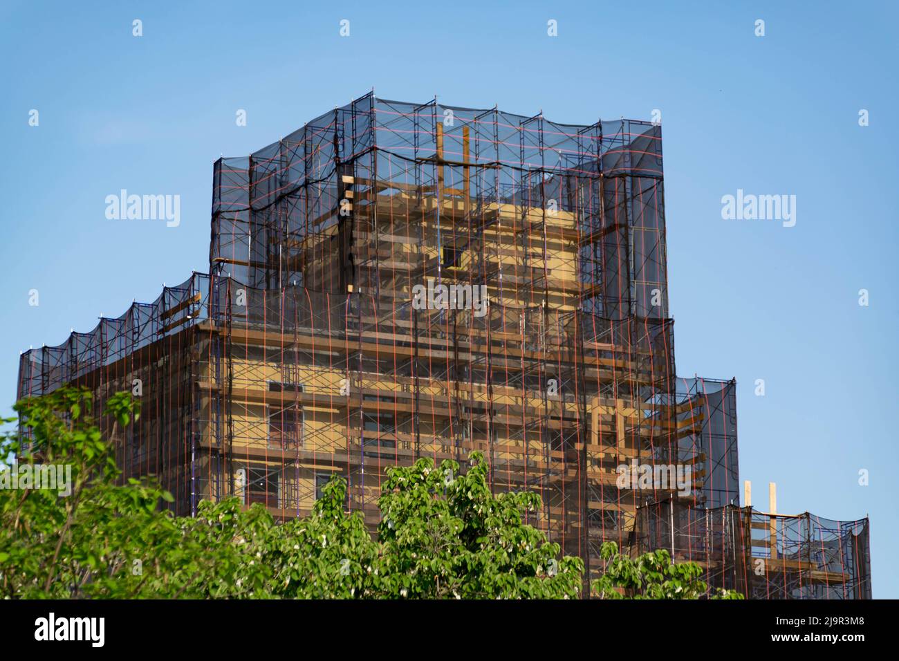 Construction Scaffolding Around Building Under Renovation Against Sky ...