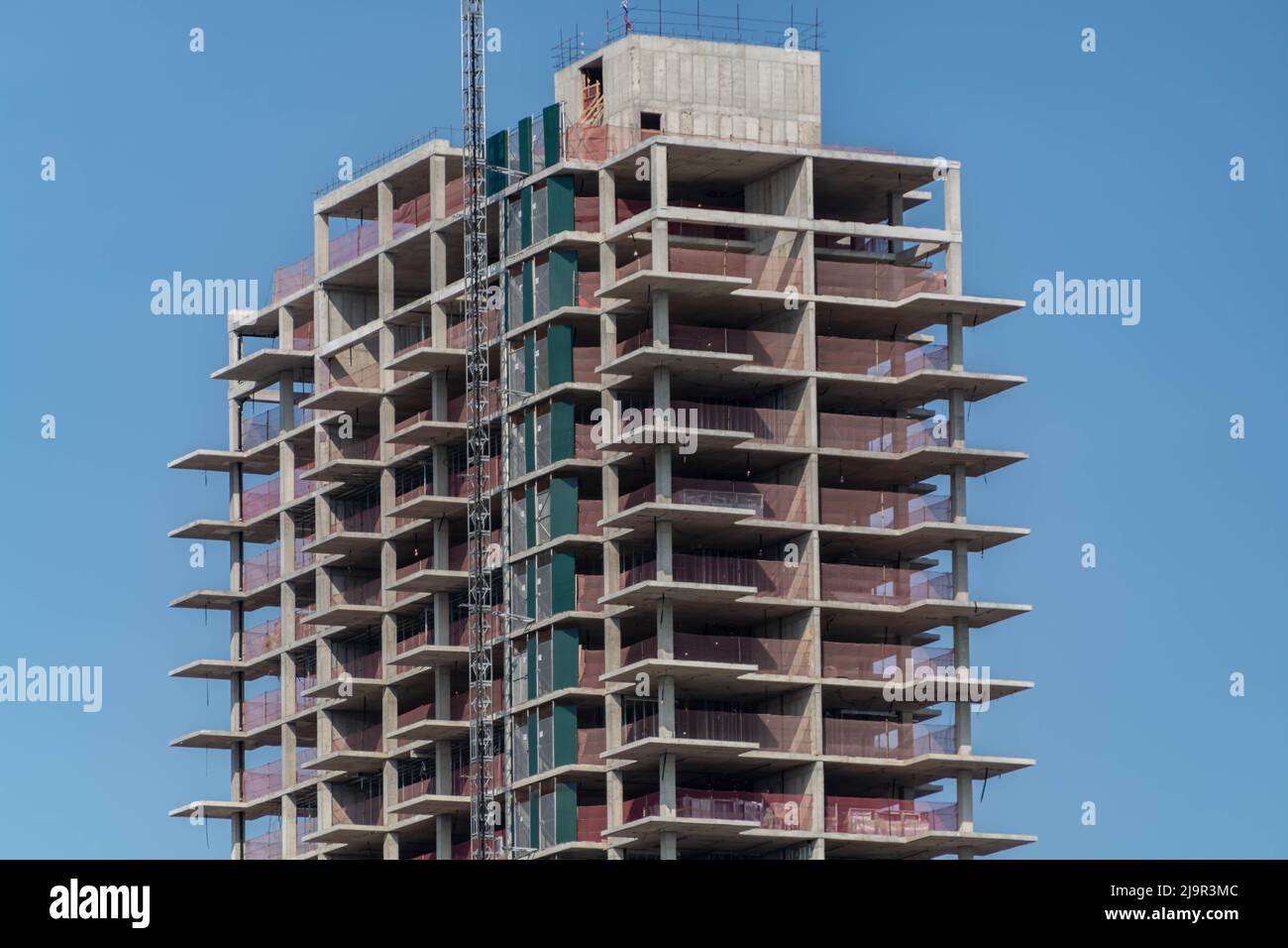 A high-rise residential building in the process of being constructed in ...