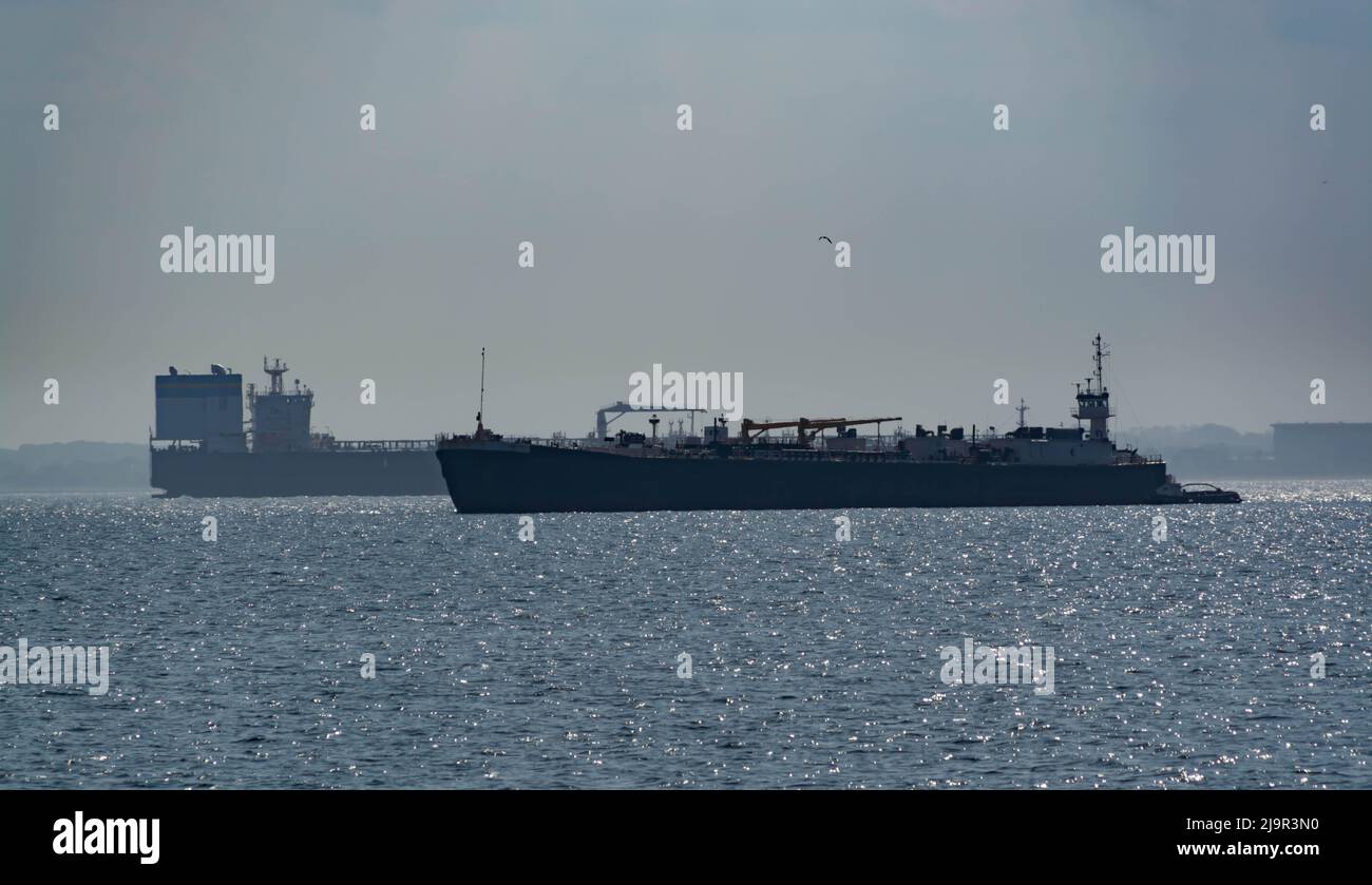 Two barges in the ocean transporting goods from overseas Stock Photo ...