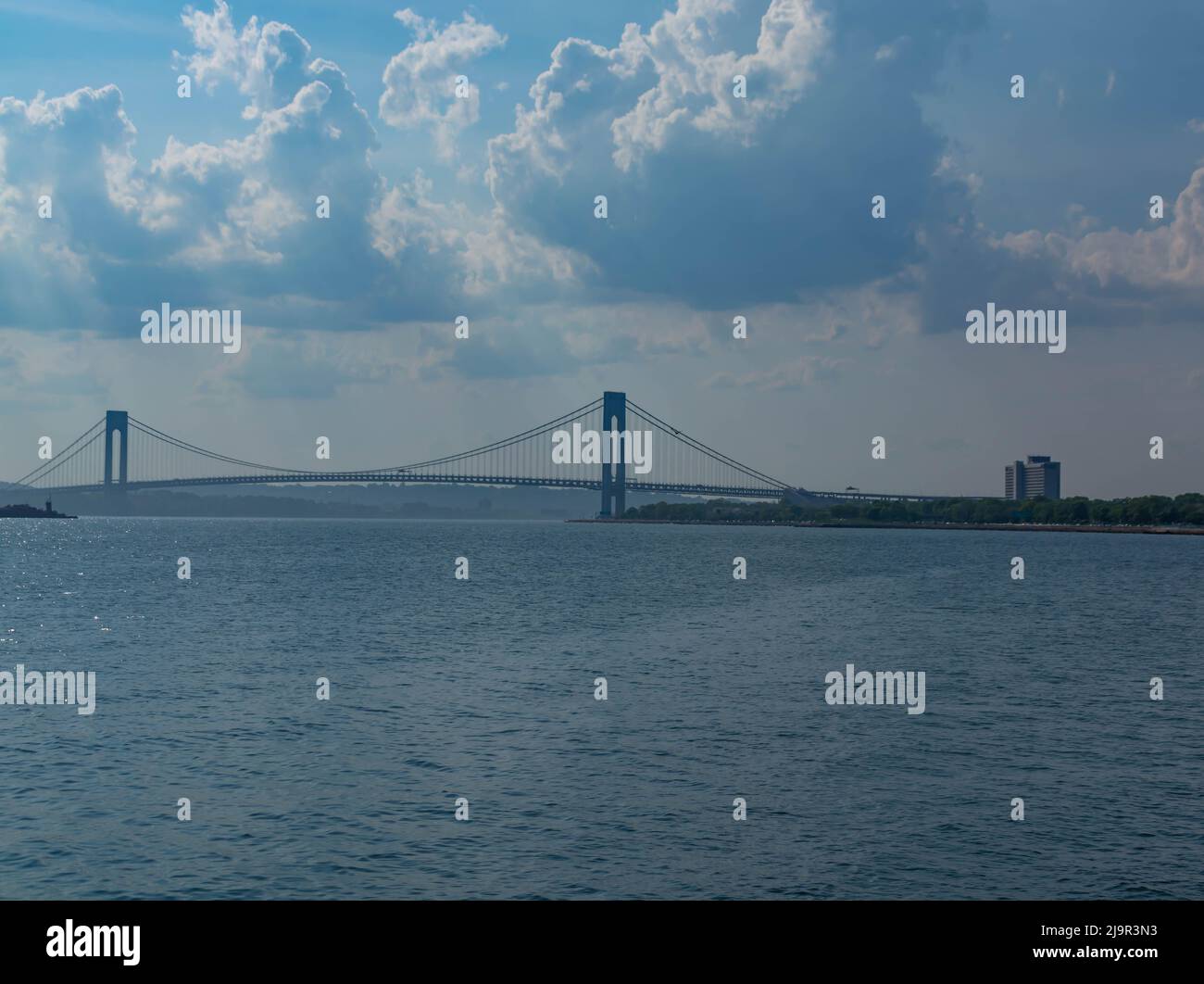 Verrazano Bridge in Brooklyn on a hot summer day. The Verrazano Bridge in Brooklyn, New York is ...
